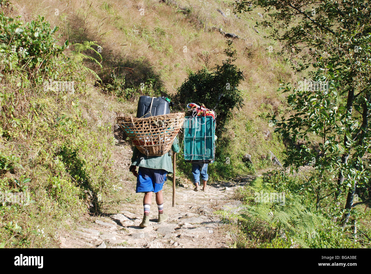 porters on a trail in Nepal Stock Photo - Alamy