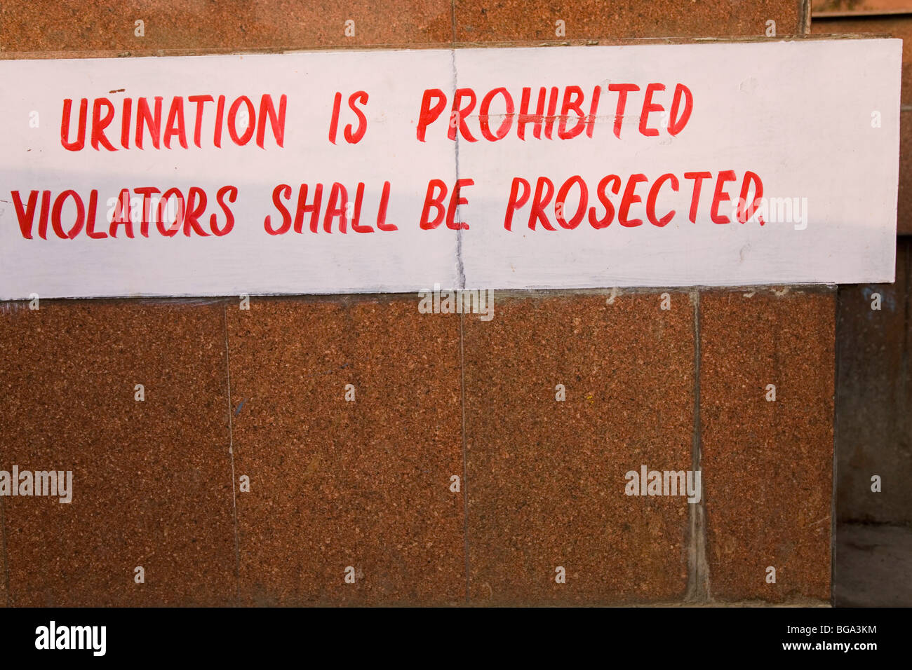 A sign makes clear that "urination is prohibited" in New Delhi, India ...