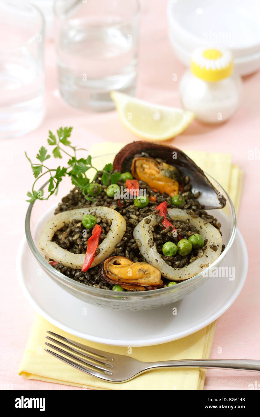 Black rice with cuttlefish. Recipe available Stock Photo - Alamy