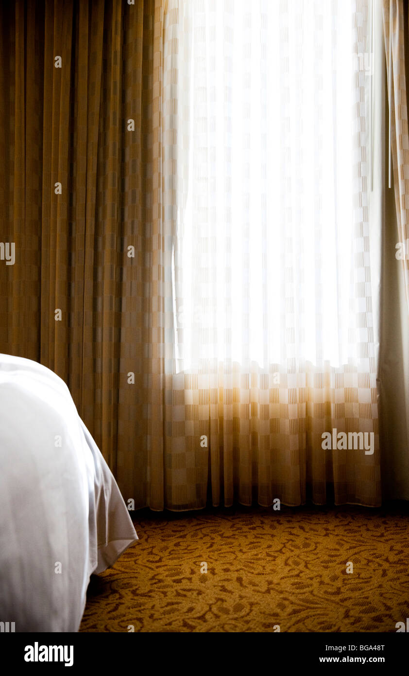 bed and window in hotel room Stock Photo - Alamy