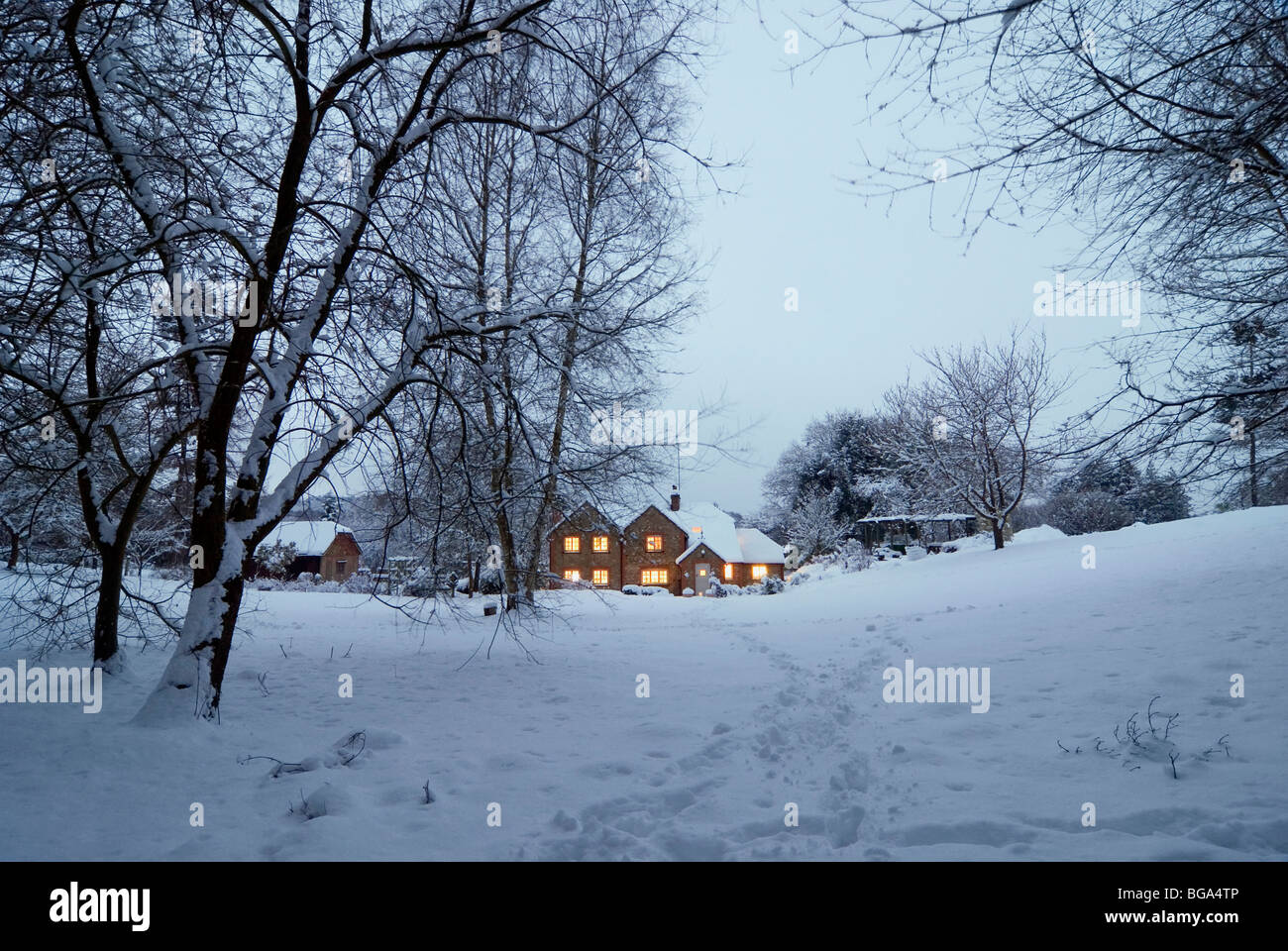 Christmas card image of a snowy landscape scene with cozy cottage with ...