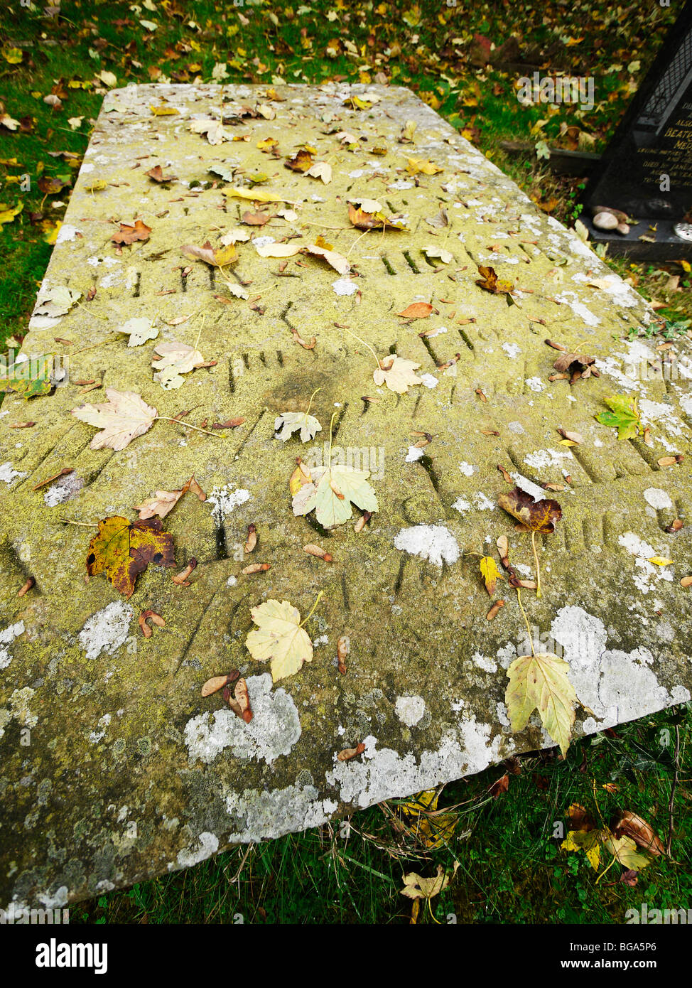 gravestones lit by the sun in a country cemetery Stock Photo - Alamy