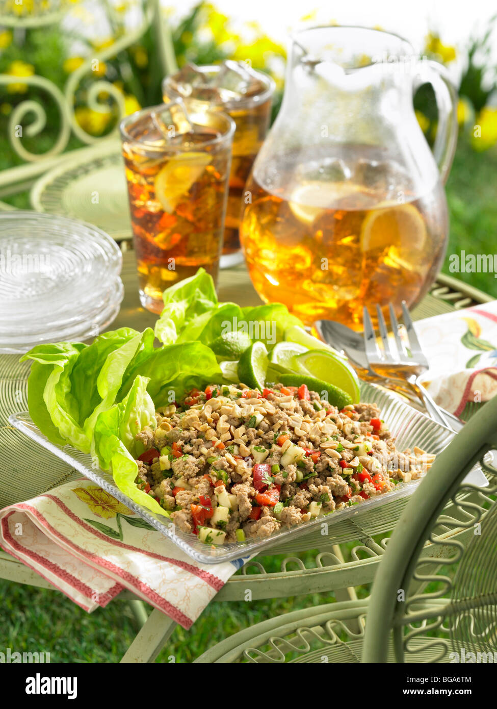 Thai larb chicken salad with iced tea in garden Stock Photo - Alamy