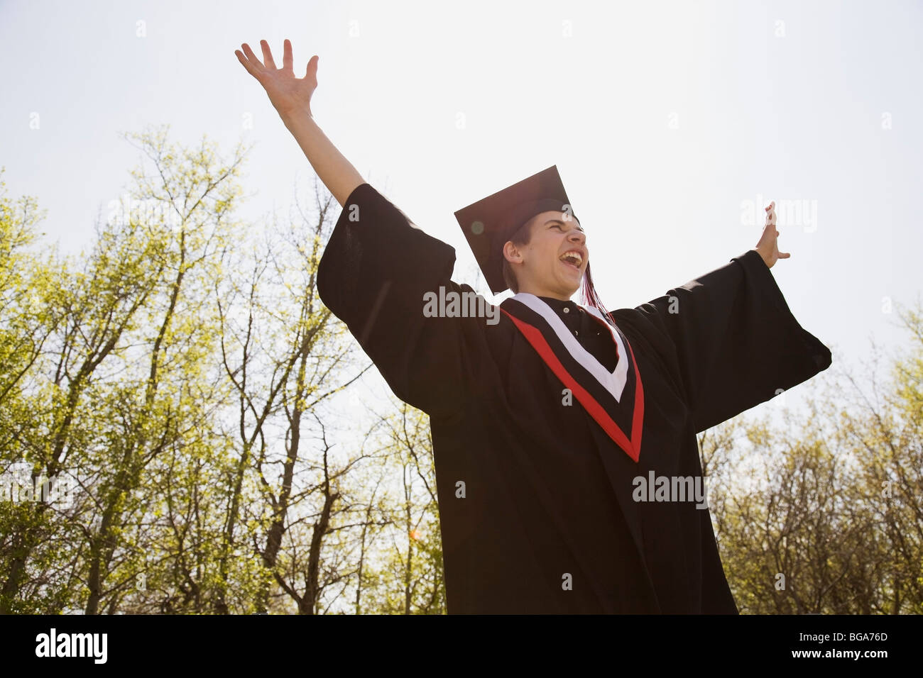 Graduate celebrating success Stock Photo - Alamy