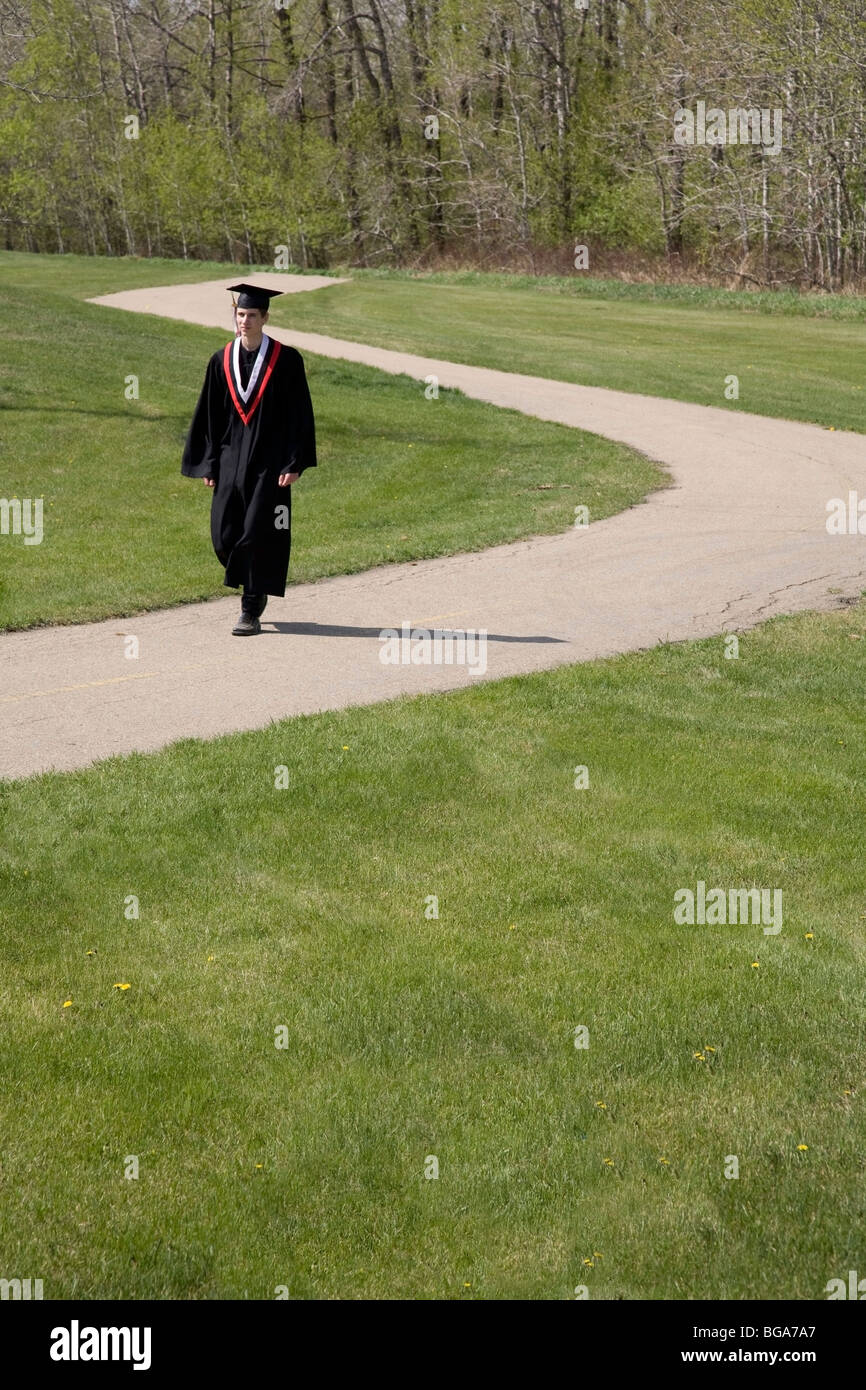 Graduate walking a path Stock Photo - Alamy
