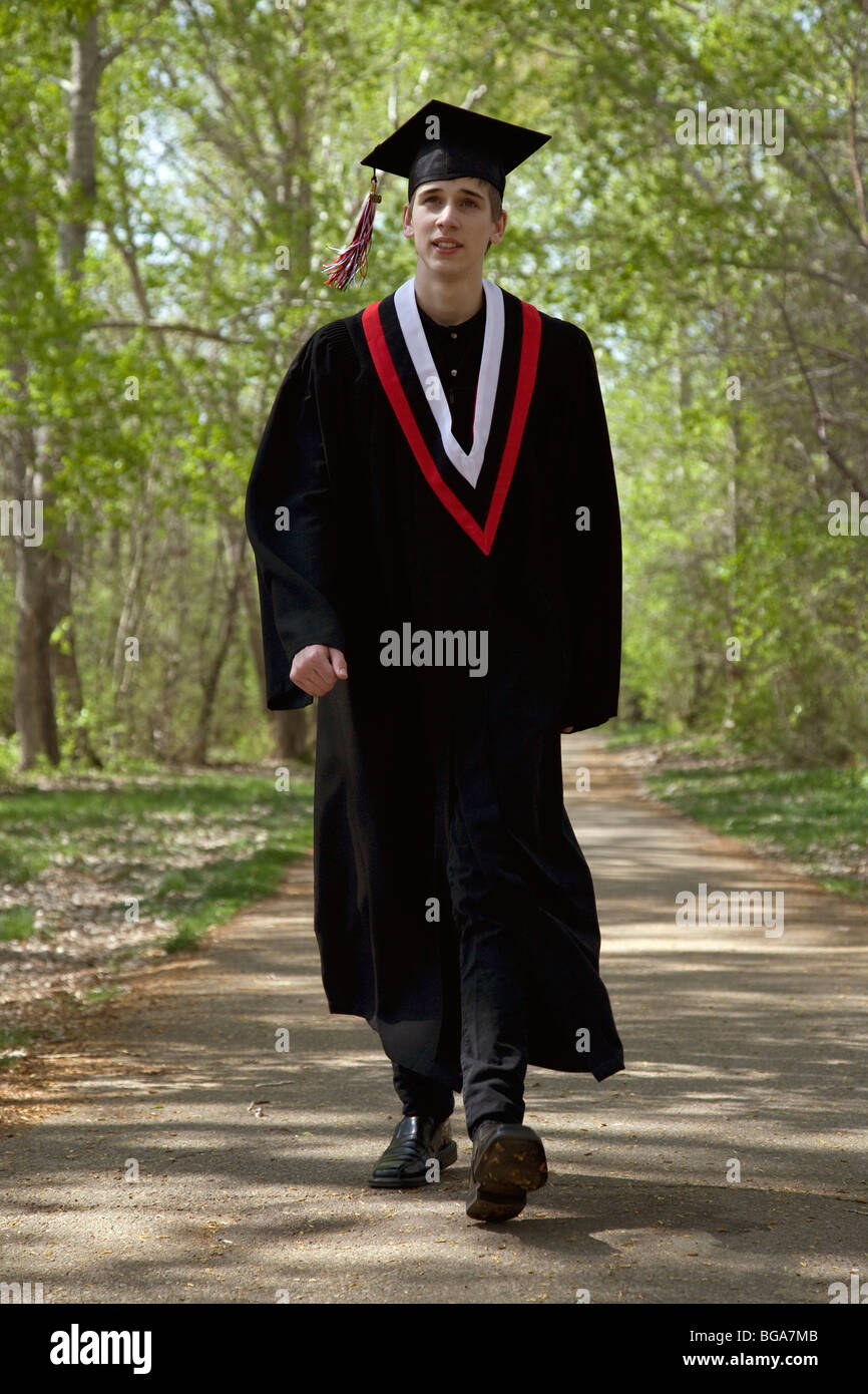 Graduate walking on a path Stock Photo - Alamy