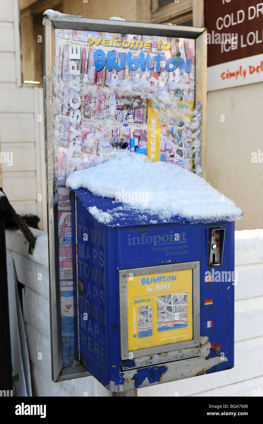 Snow gathers on top of brighton information point map Stock Photo - Alamy