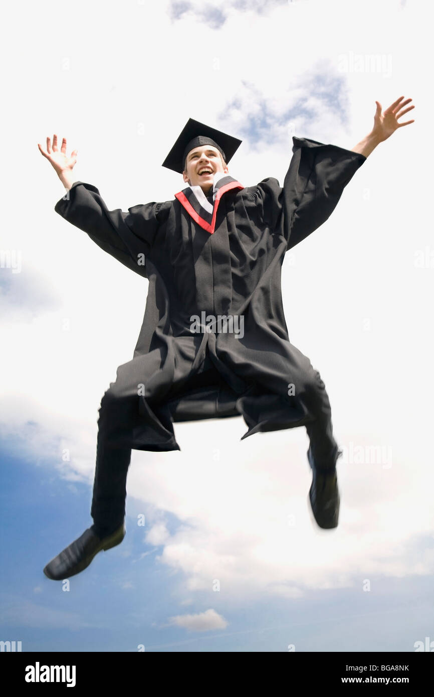 Graduate jumping joy hi-res stock photography and images - Alamy