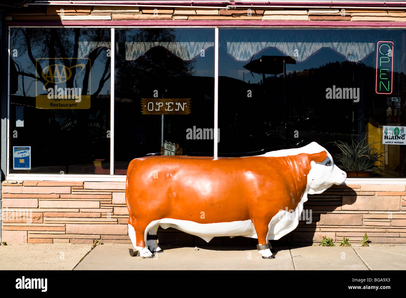 Statue of a cow on display outside a restaurant in Williams, Arizona ...