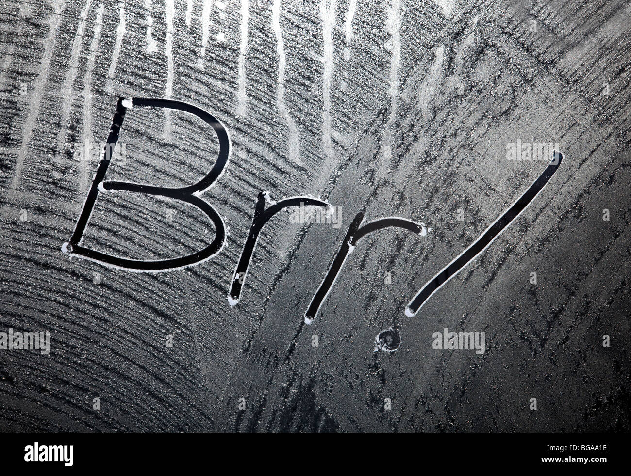 The word Brr written in Frost on a car windscreen during winter in the ...