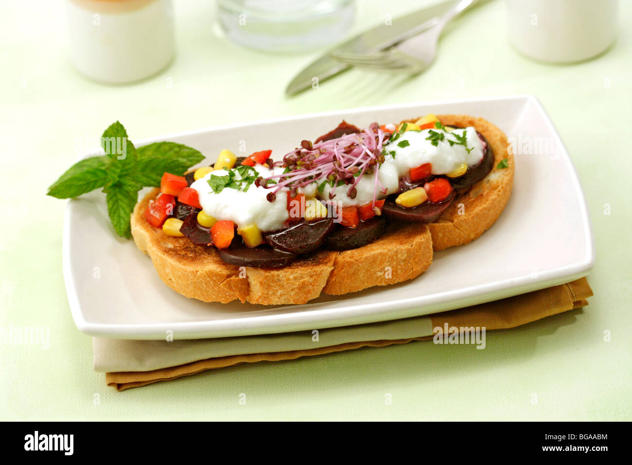 Toasted bread with vegetables. Recipe available Stock Photo - Alamy