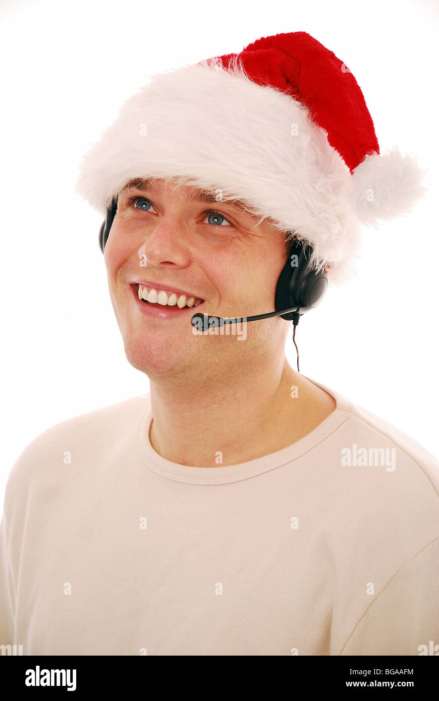 Young office worker wearing a Santa hat Stock Photo - Alamy