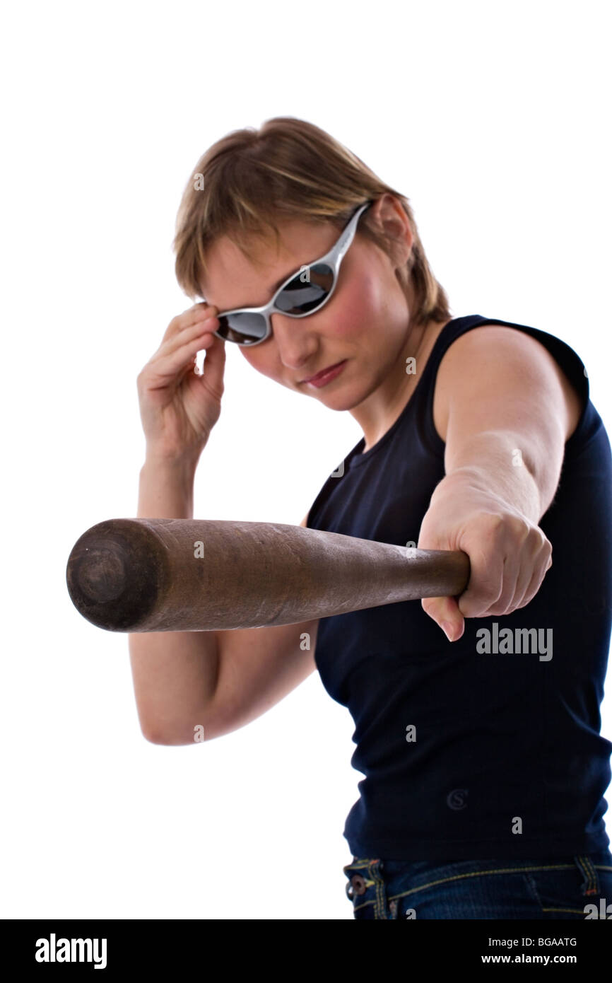 Portrait of the serious woman with wooden bat in hand. Small DOF ...