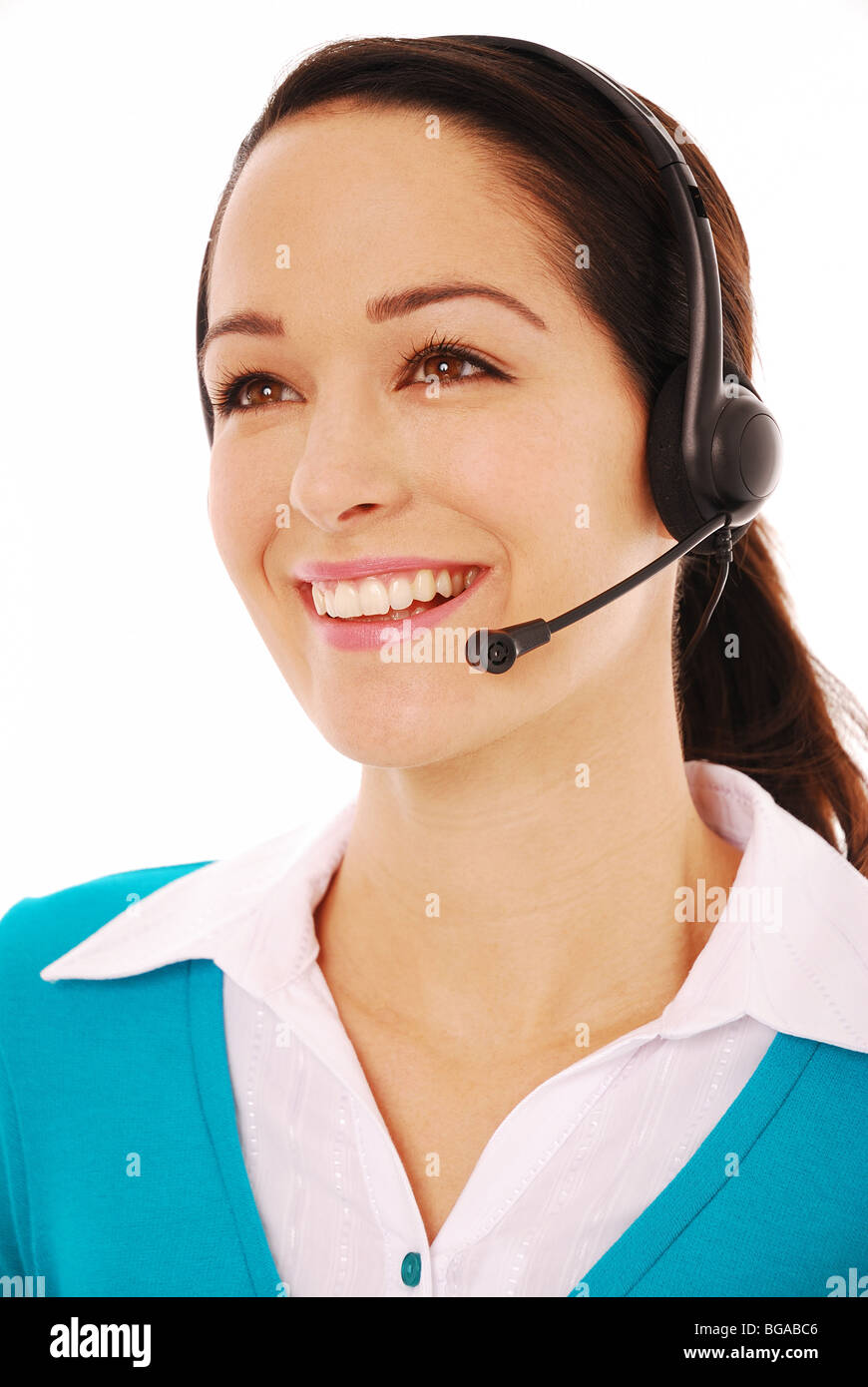 Young woman wearing headphones and talking into a microphone Stock ...