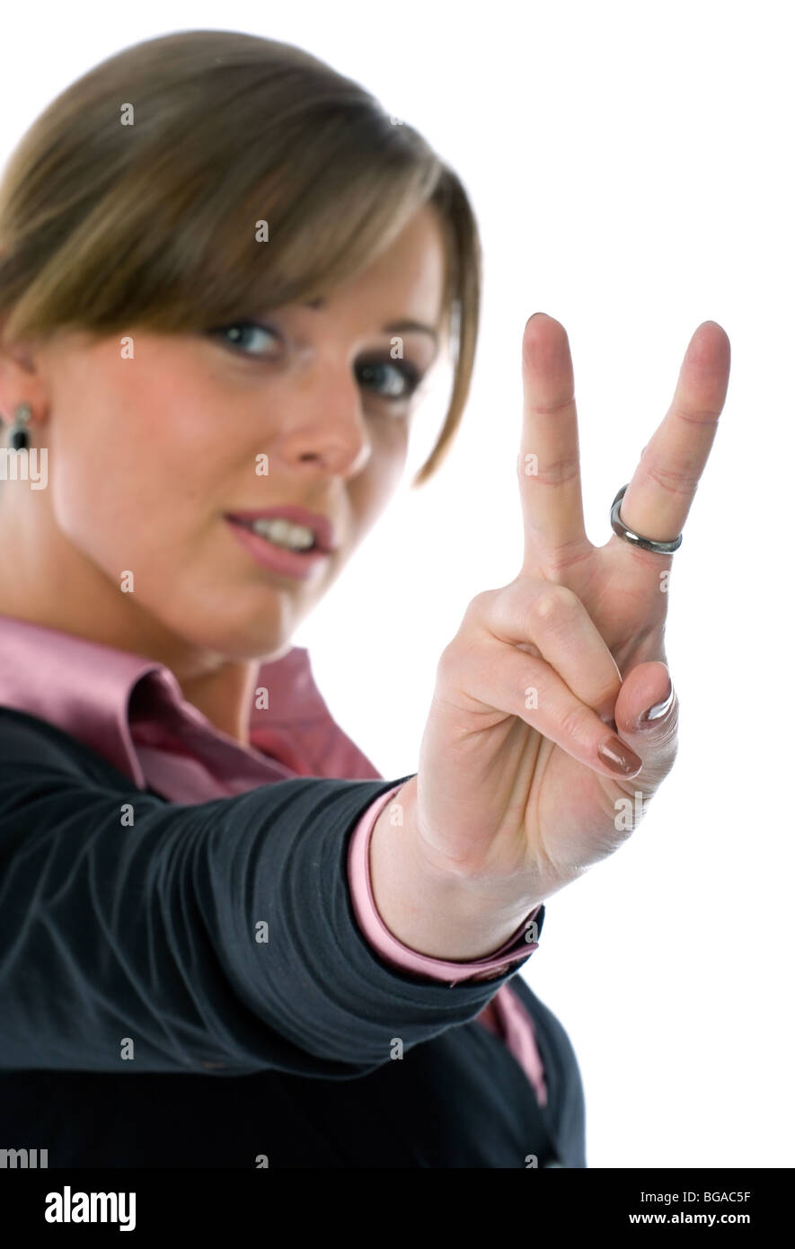 young beautiful business woman with victory gesture of her hand ...