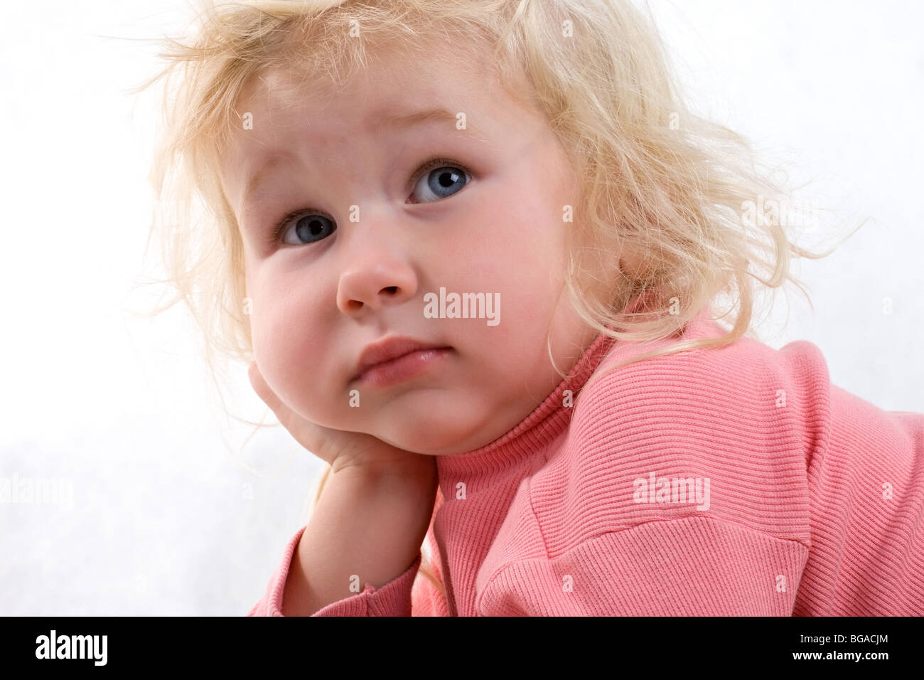 close-up portrait of sad baby on white background Stock Photo - Alamy