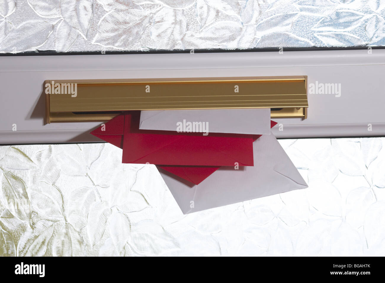 letters and cards in the interior of a letterbox of a house in the uk ...