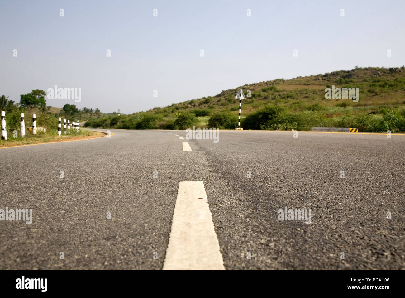 The smooth tarmac surface of State Highway 57 in Karnataka, India. The ...