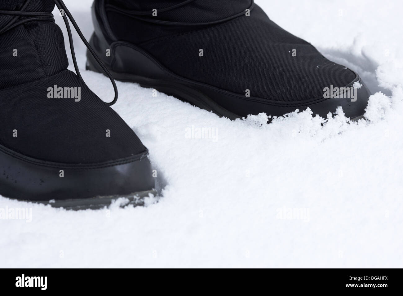snowboots being worn in snow Stock Photo - Alamy