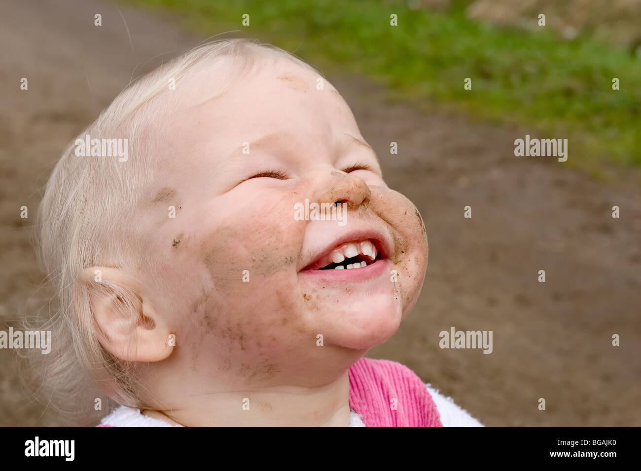 dirty-faced child with amusing smile Stock Photo - Alamy