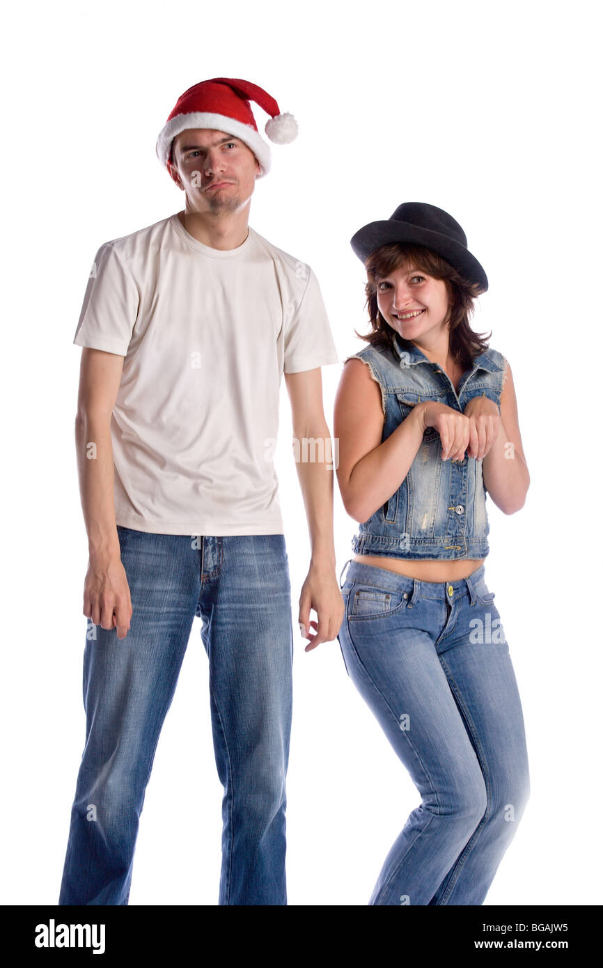 young man in Santa's red hat and attractive woman in jeans, denim ...