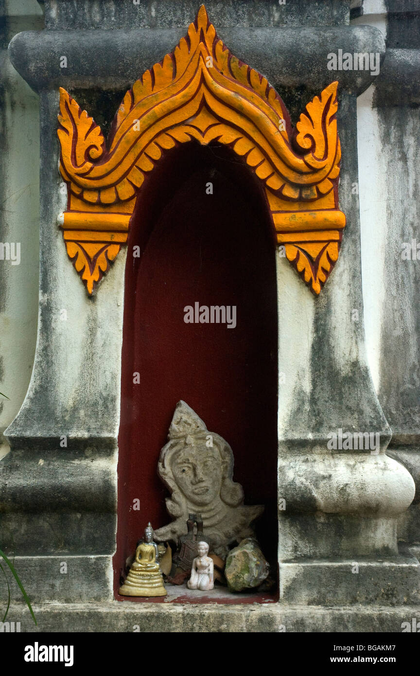 A simple offering niche at a Buddhist Stupa or Wat, in Chiang Mai ...