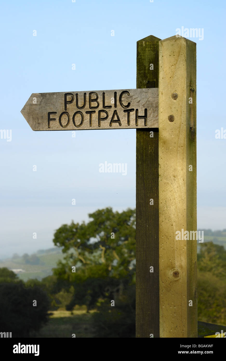 Signpost with Public footpath written on it in the British countryside ...