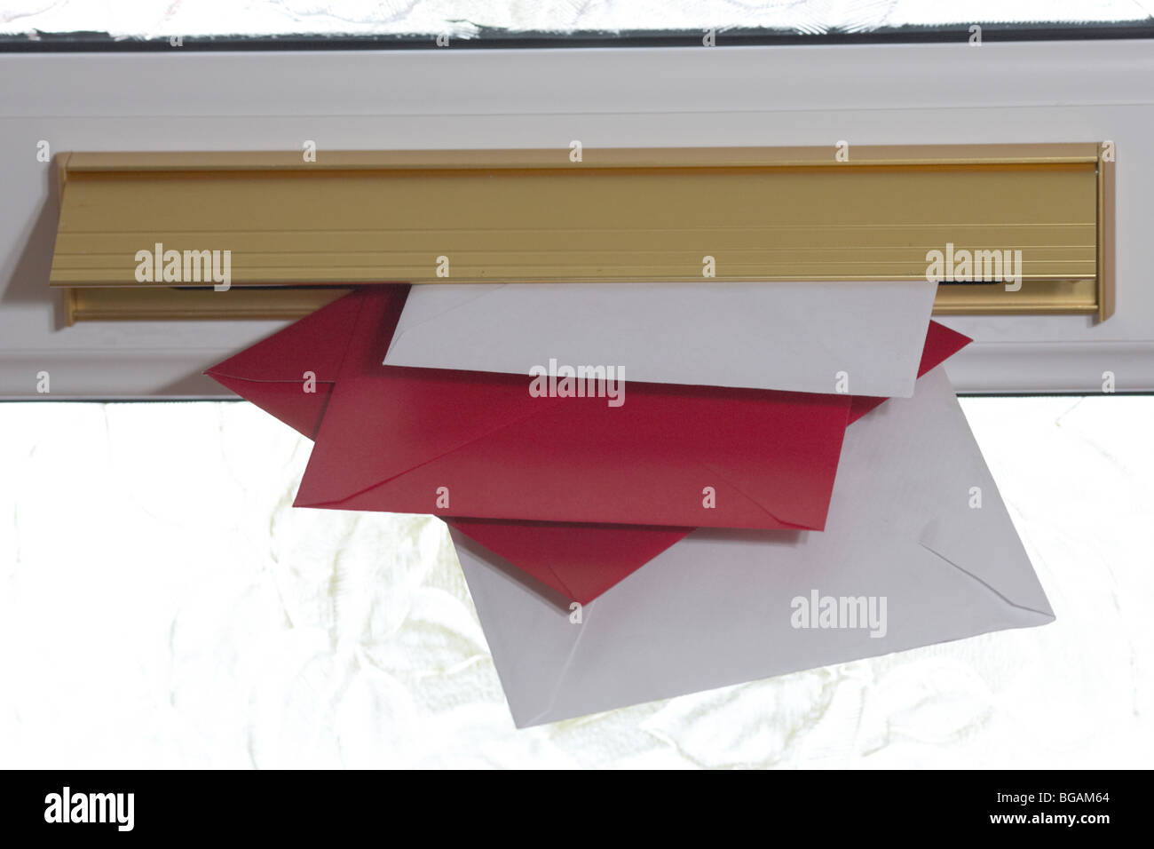 letters and cards in the interior of a letterbox of a house in the uk ...