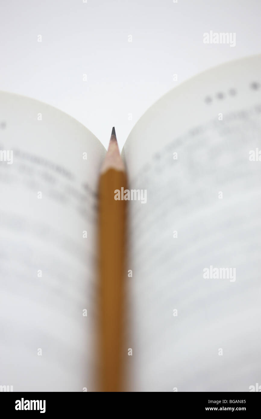 Pencil in a book Stock Photo - Alamy