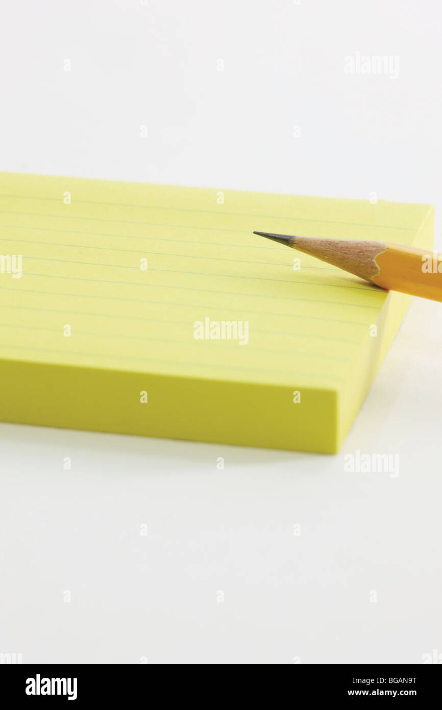Pencil and adhesive note Stock Photo - Alamy