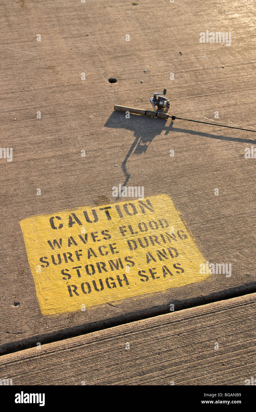 Wave warning printed on pier. Holland State Park, Michigan Stock Photo ...