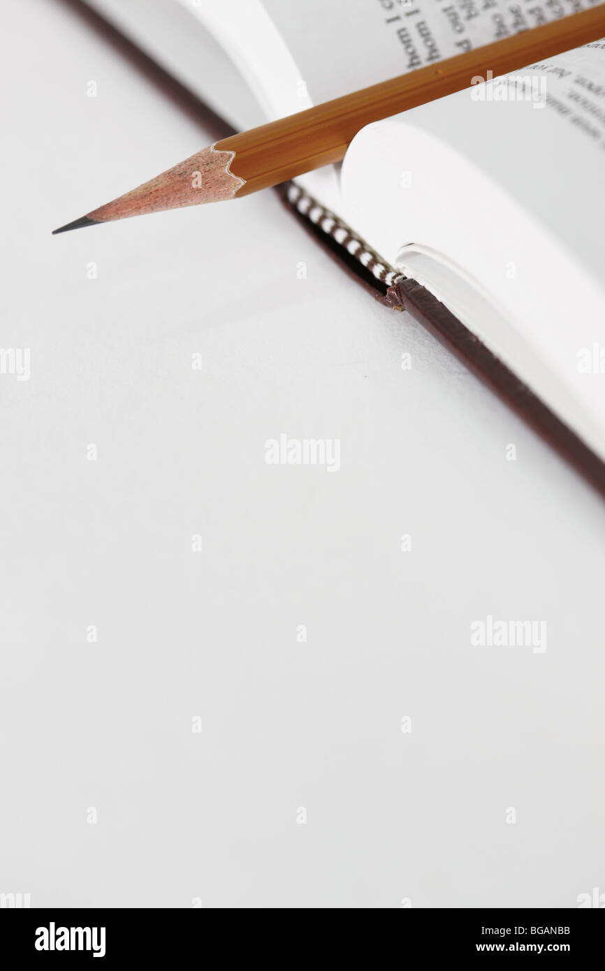 Pencil in a book Stock Photo - Alamy