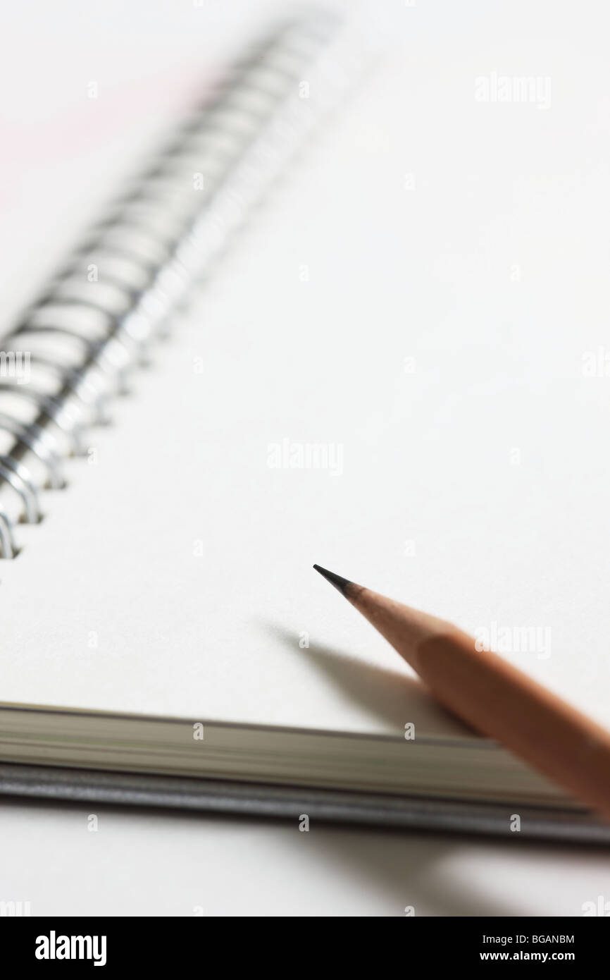 Pencil and notebook Stock Photo - Alamy