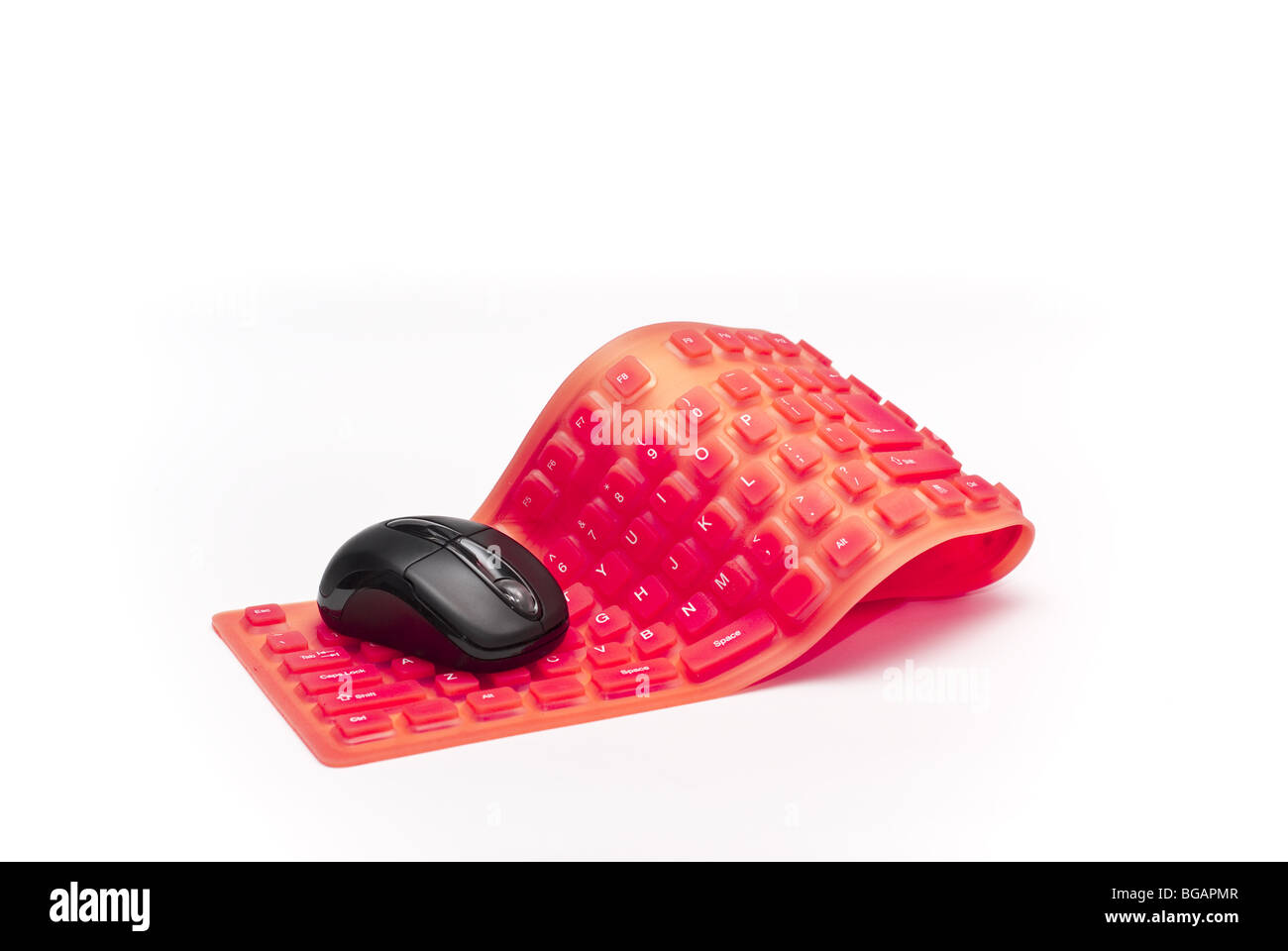 magenta flexible computer keyboard with black mouse isolated on white ...