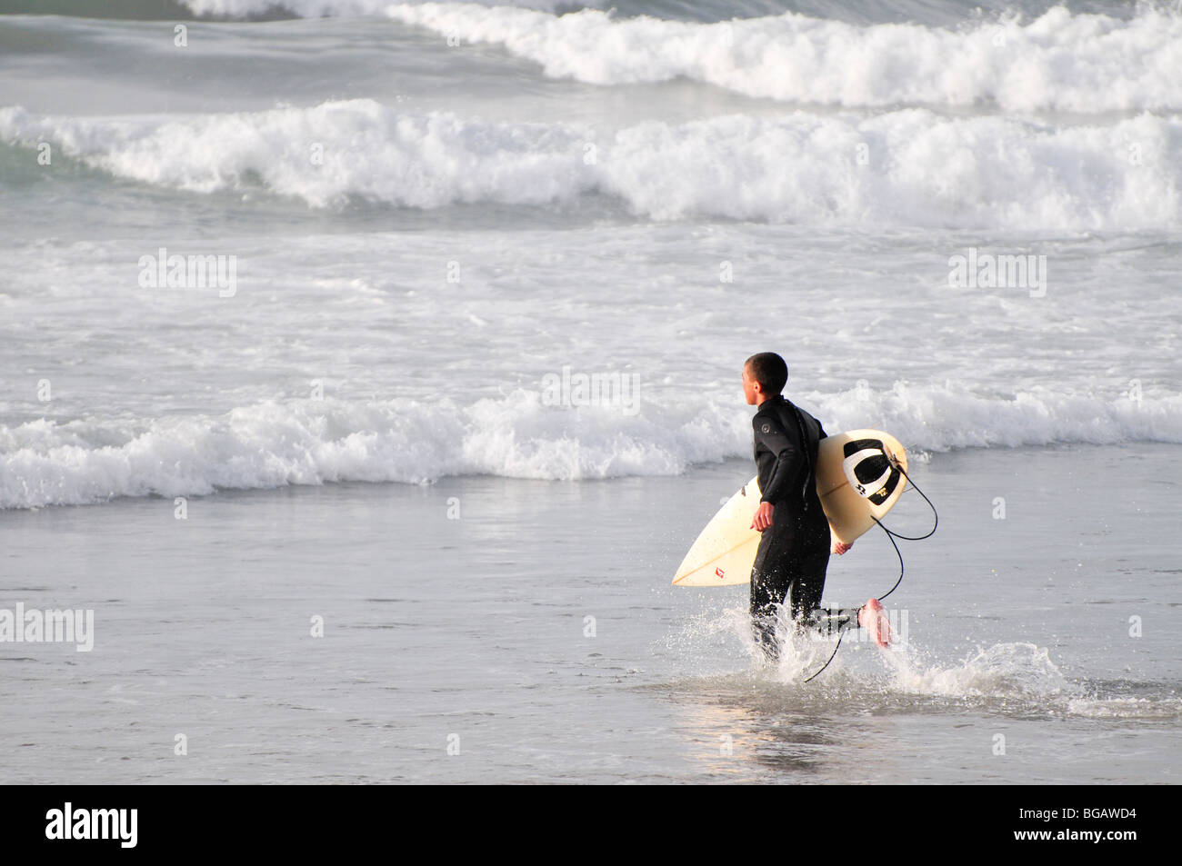 Israel, Haifa, Dado Beach, Surfer enters the sea Stock Photo - Alamy