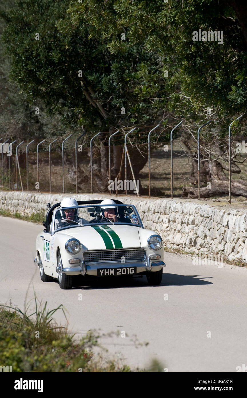 White 1968 Austin Healey sprite classic sports car being driven in a ...