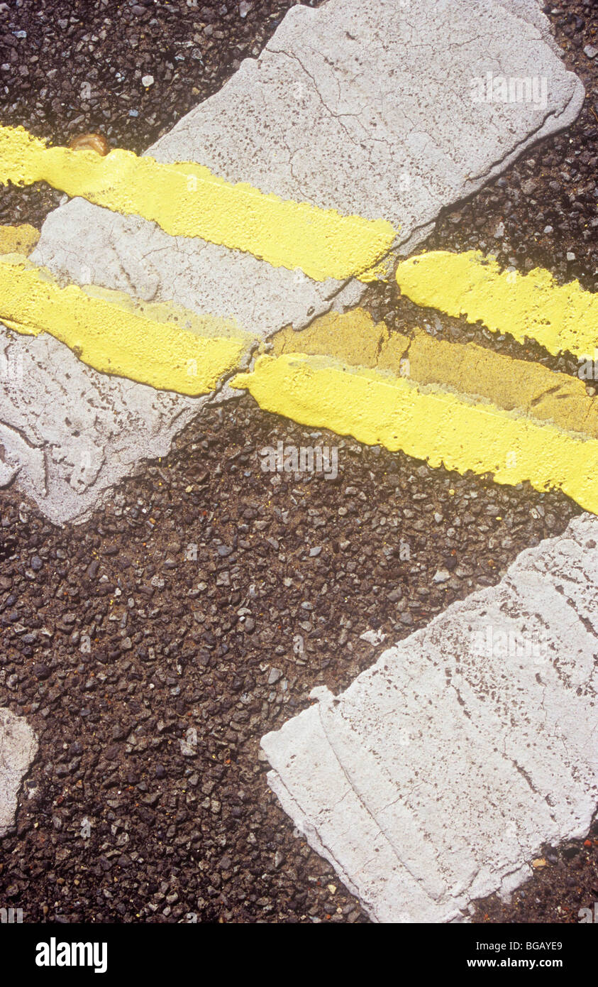 Detail from above of double yellow lines running across white Give Way ...