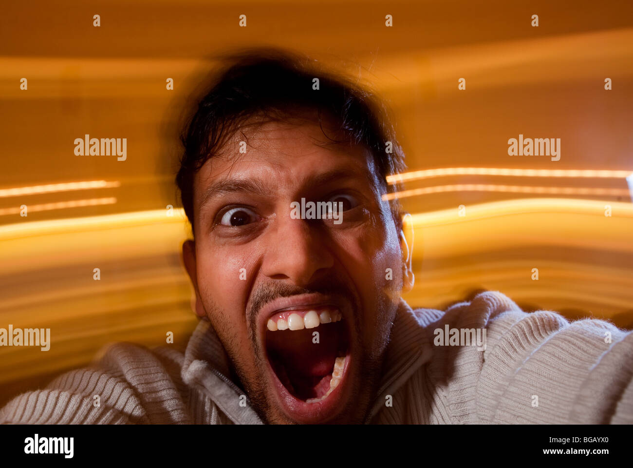 Man screaming spinning lights Stock Photo - Alamy