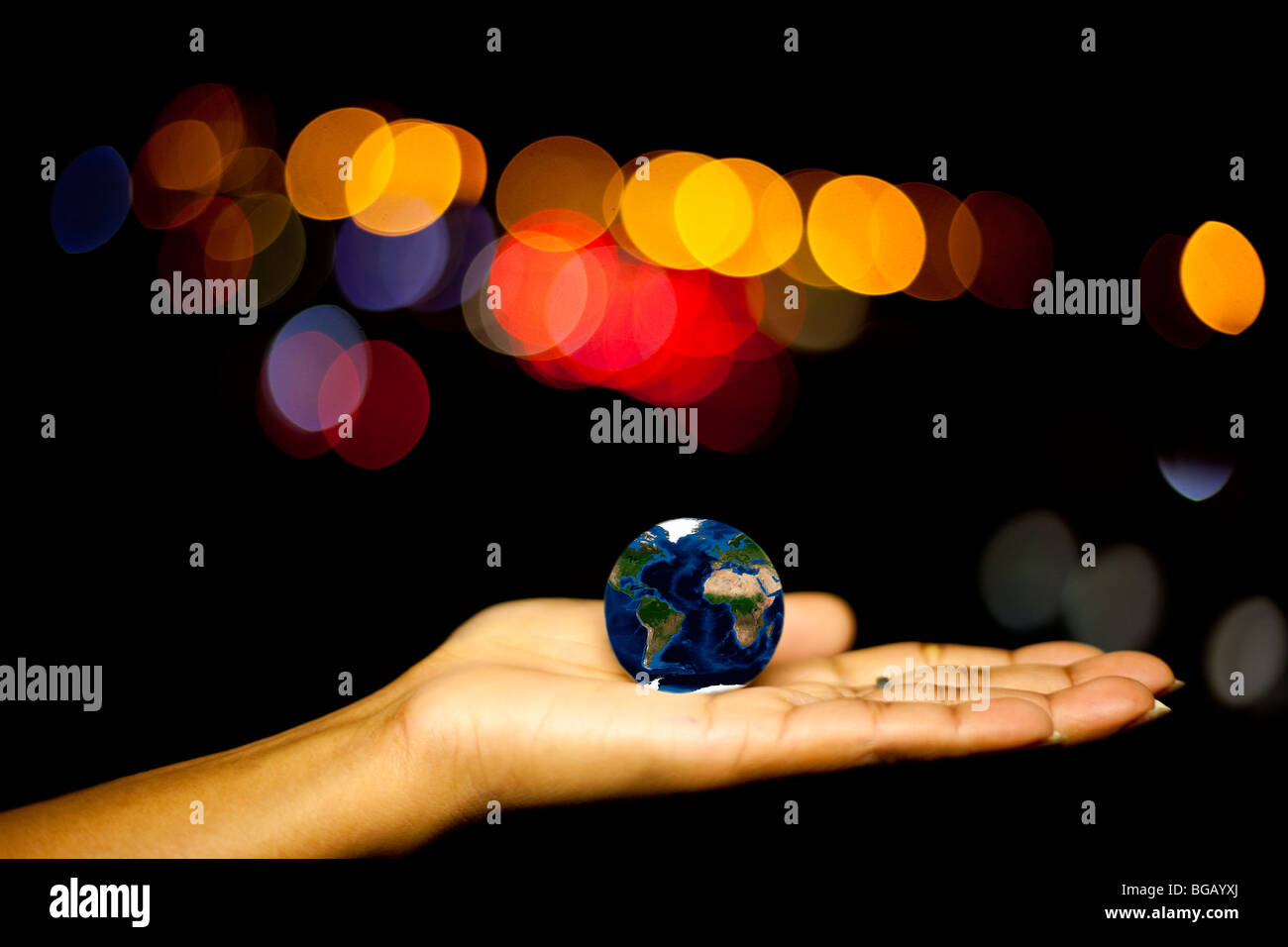 Globe / Earth on hand Stock Photo - Alamy