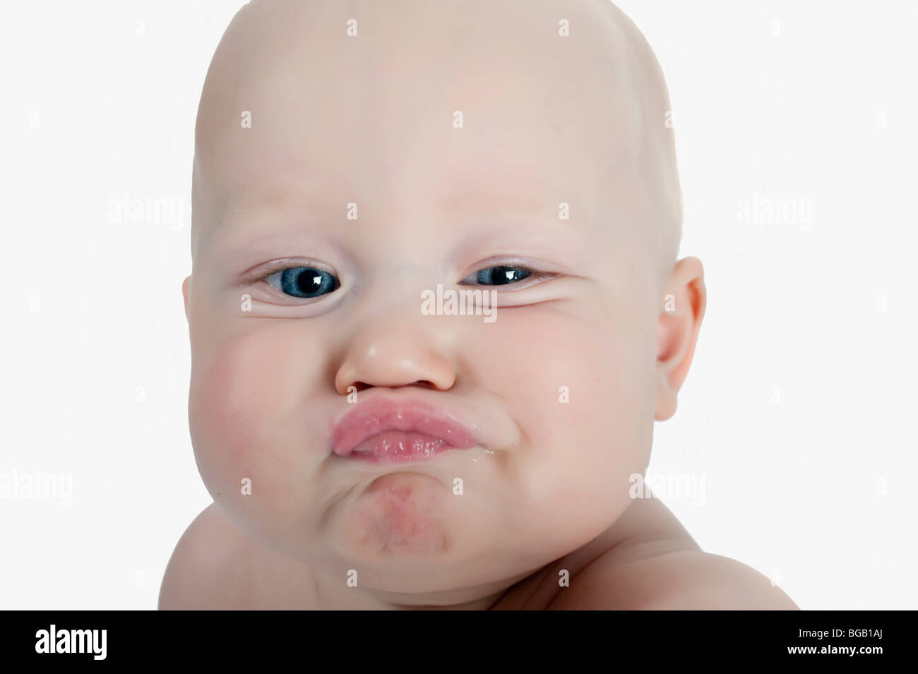 Baby making a funny face Stock Photo - Alamy