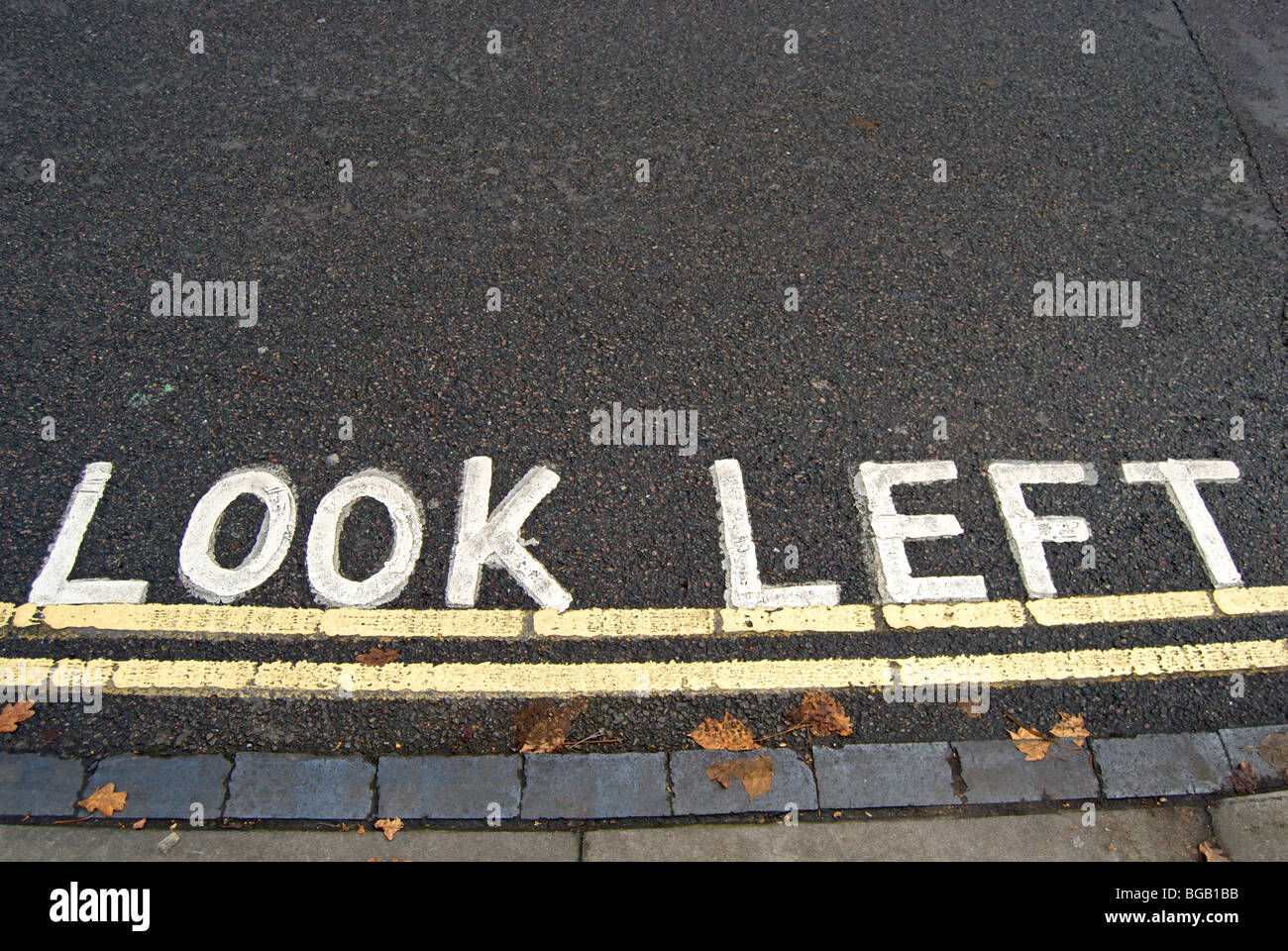 british look left road marking with double yellow lines Stock Photo - Alamy