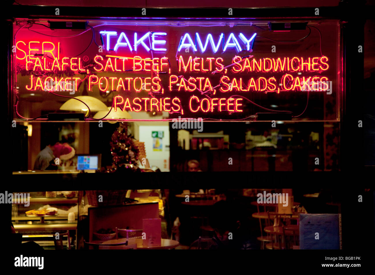 Neon take away sign offering falafel, salt beef, sandwiches, coffee ...