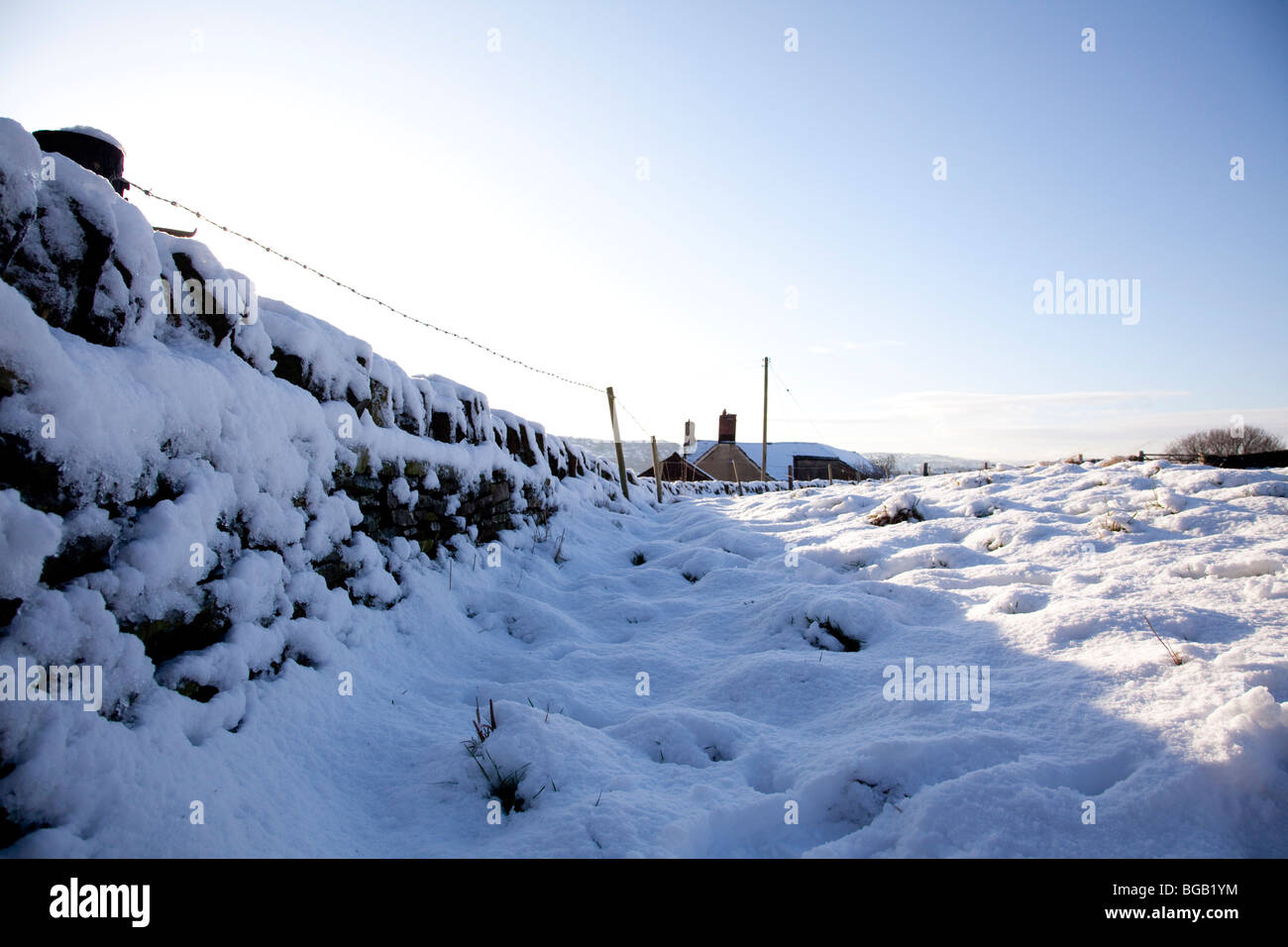Heavy winter snowfall in Yorkshire, England covers a farmers field with ...