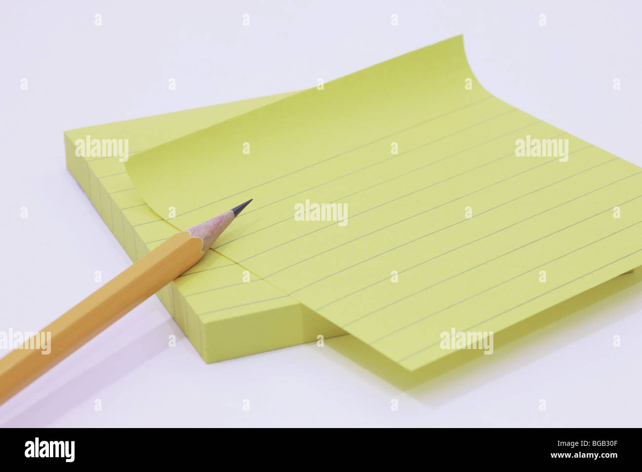 Pencil and adhesive note Stock Photo - Alamy