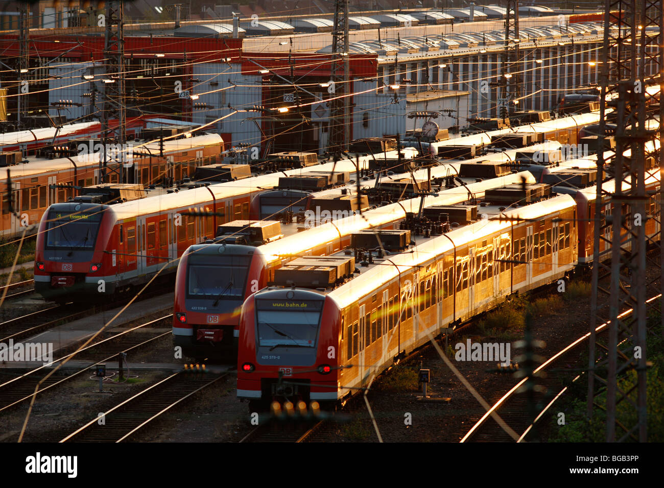 city trains on tracks in front of the central Station, Essen, Germany ...