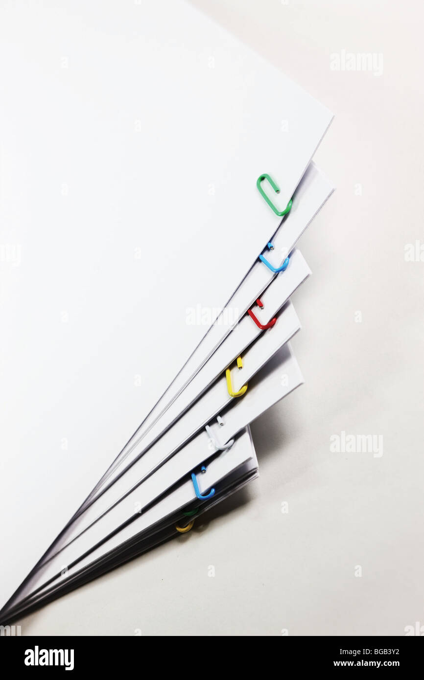 Paper clips and paper Stock Photo - Alamy