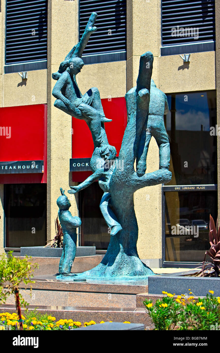 Bronze sculpture of children playing in a tree, titled "Free Children ...