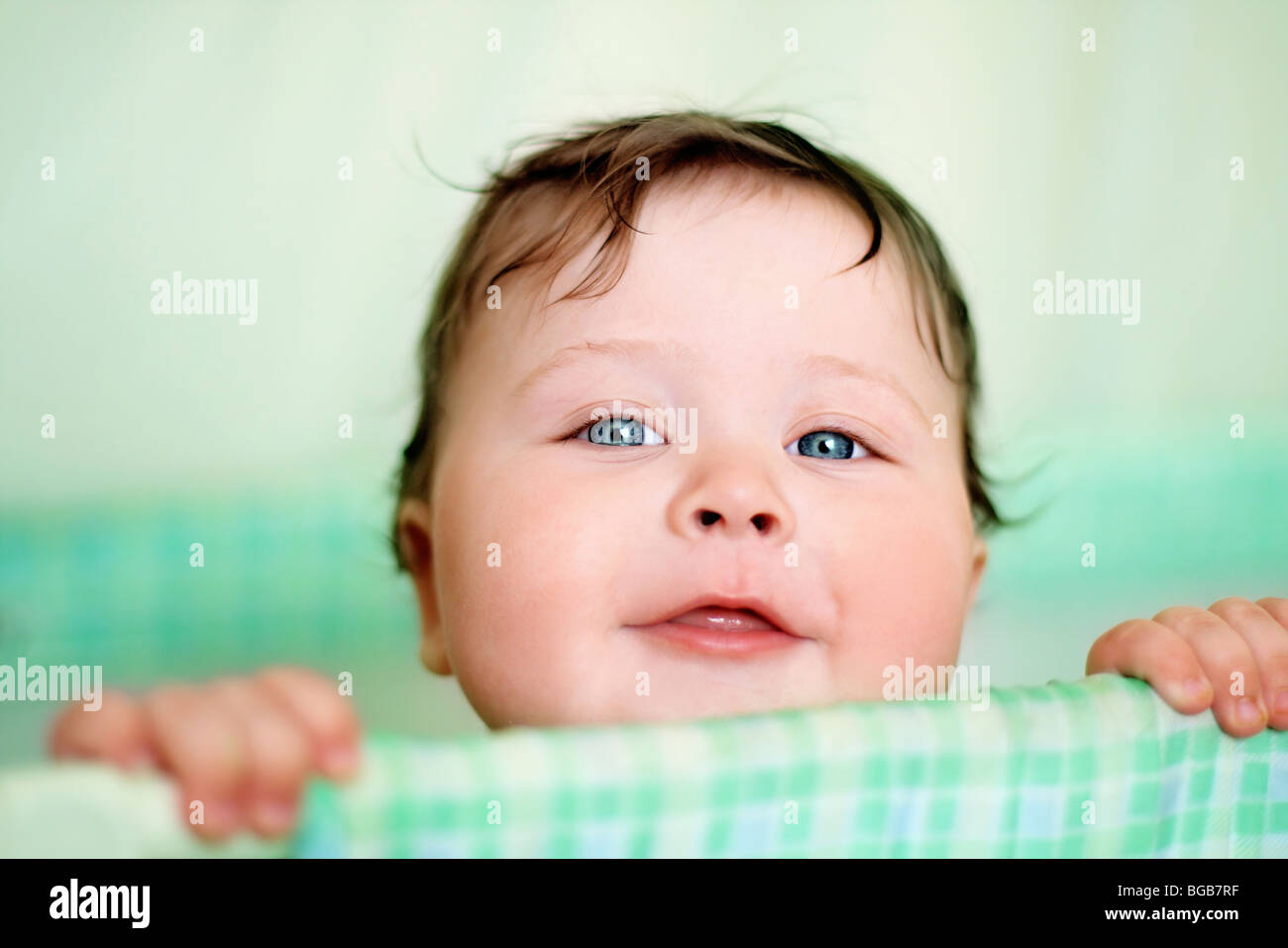 portrait of beautiful baby in blue bad Stock Photo - Alamy