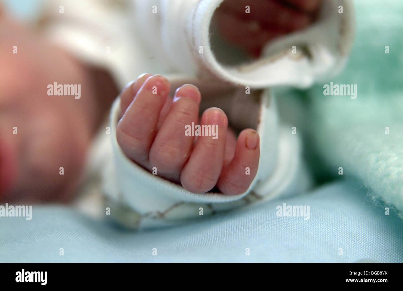 Premature baby in incubator hand hi-res stock photography and images ...