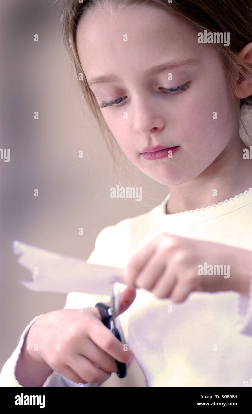 Royalty free photograph of child girl enjoying arts and crafts lesson ...